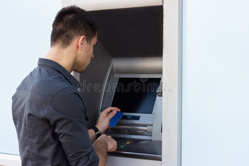 Young man using ATM stock image. Image of 2529, currency - 36025481