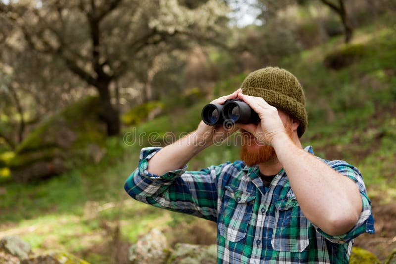 Young Man using binoculars stock photo. Image of looking - 92949550