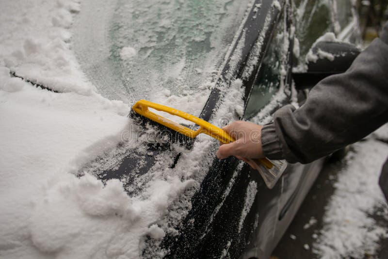 Man Using Brush To Remove Snow from the Car Stock Photo - Image of ...