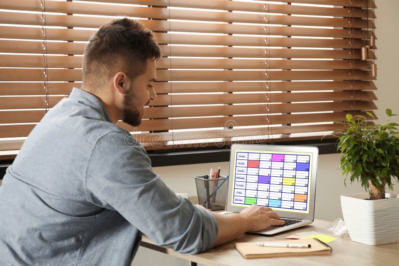Young Man Using Calendar App on Laptop Stock Image - Image of manager ...