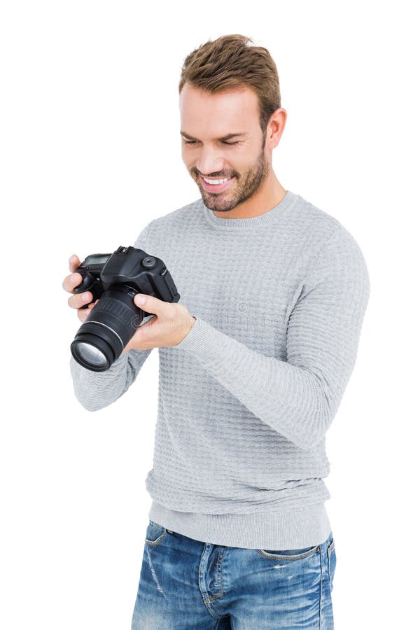 Young man using camera stock photo. Image of smiling - 68119998