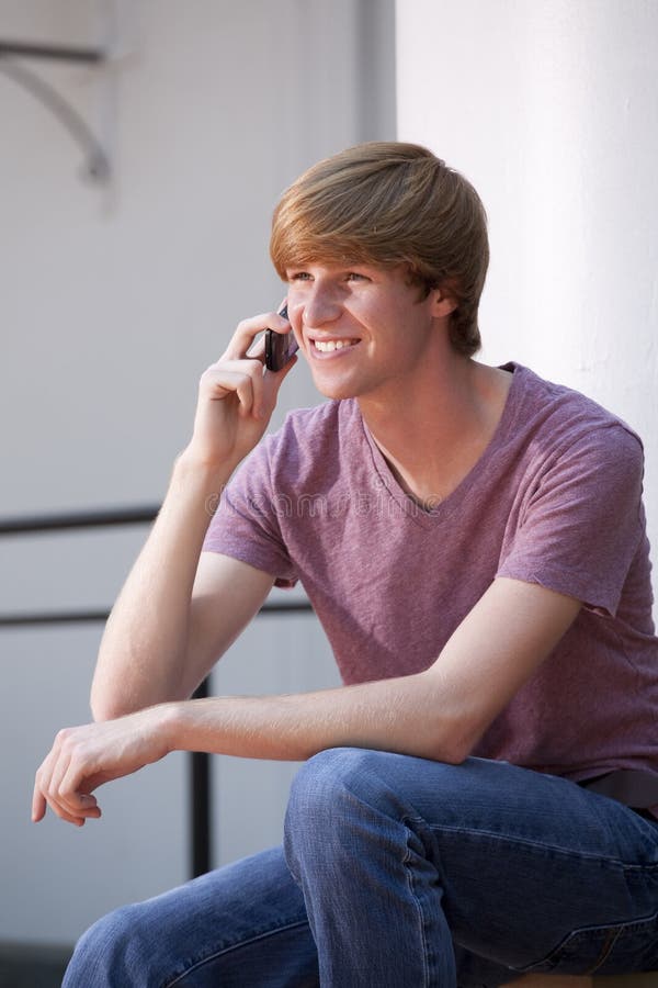 Young Man Using a Cell Phone Stock Image - Image of male, communication ...