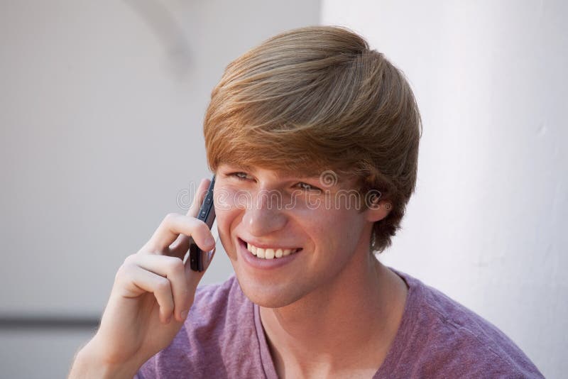 Young Man Using a Cell Phone Stock Photo - Image of holding, male: 20432356