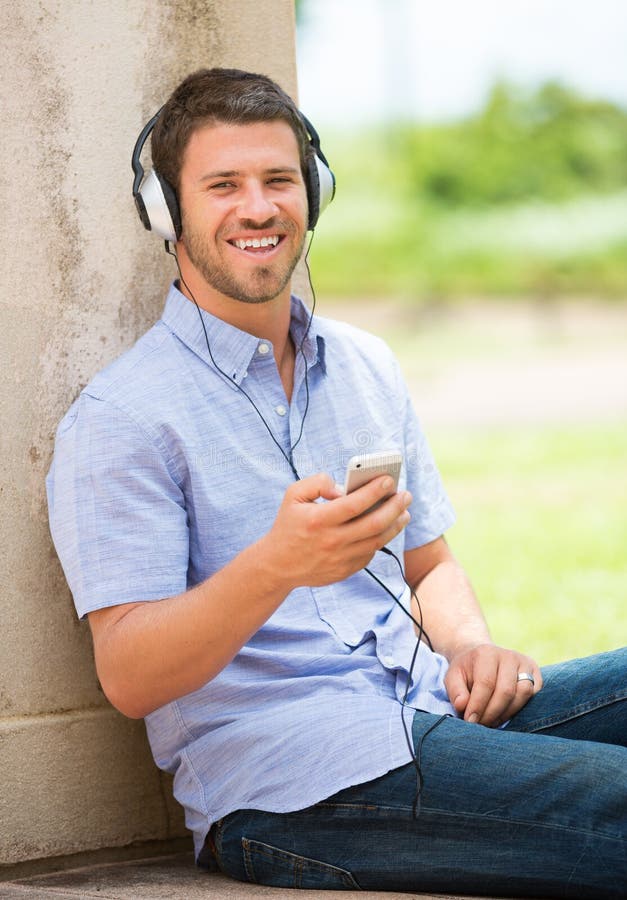 Young man using cell phone stock image. Image of smartphone - 42018553