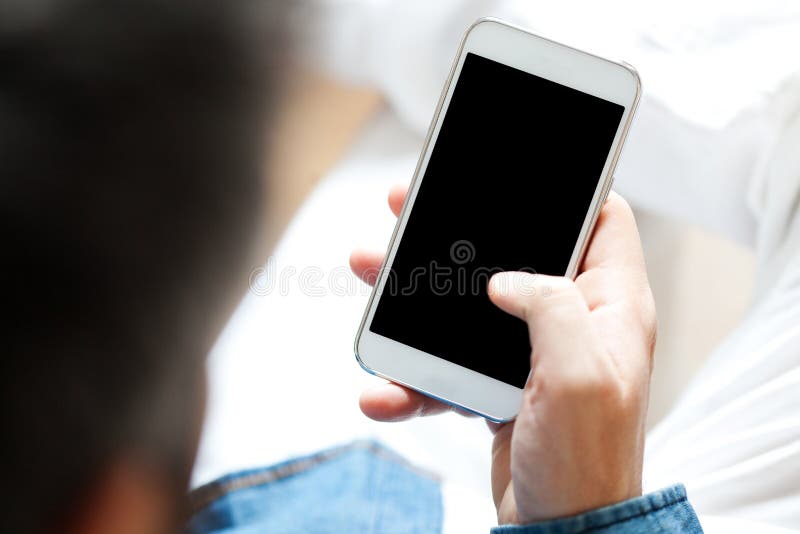 Young man using cell phone stock photo. Image of casual - 71906648
