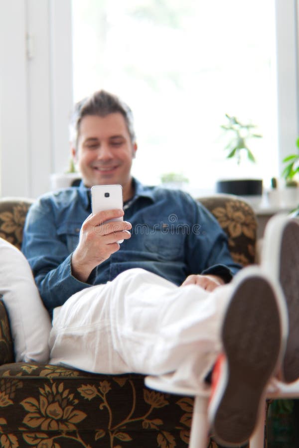 Young man using cell phone stock photo. Image of beautiful - 71907398