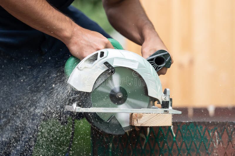 Man Using Circular Saw To Cut Off Wood Stock Photo - Image of building ...