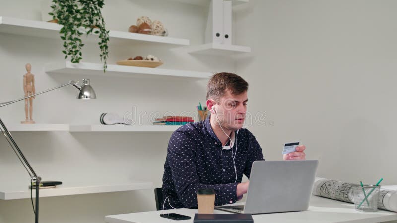 A Young Man Using a Computer Indoors Stock Photo - Image of caucasian ...