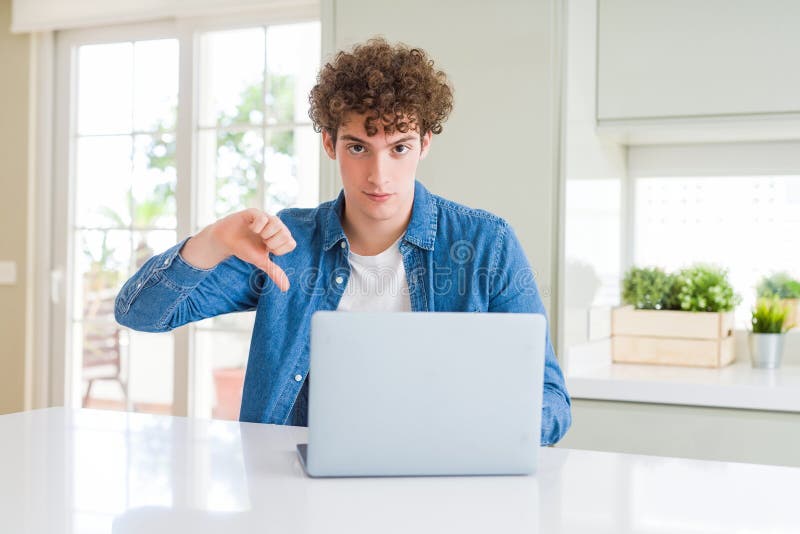 Young Man Using Computer Laptop with Angry Face, Negative Sign Showing ...