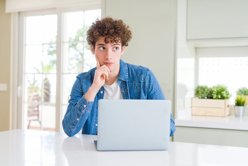 Young Man Using Computer Laptop Serious Face Thinking about Question ...