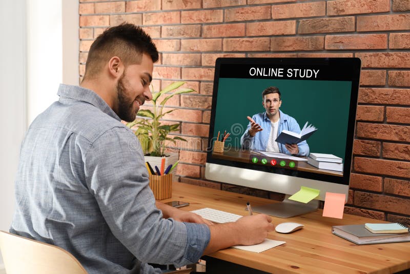 Young Man Using Computer for Online Studying Stock Image - Image of ...