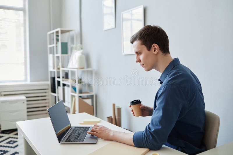 Young Man Using Computer at Workplace in Office Stock Photo - Image of ... Young Man Using Computer at Workplace in Office Stock Photo - Image of ...