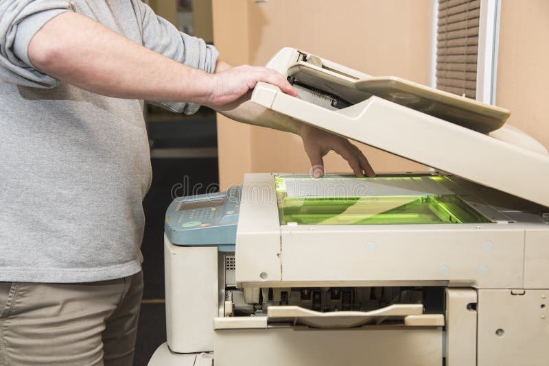 Copying and Scanning Documents on a Machine Stock Photo - Image of male ...