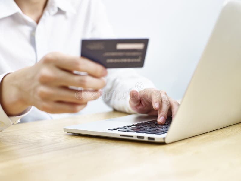 Young Man Using Credit Card while Shopping Online Stock Image - Image ...