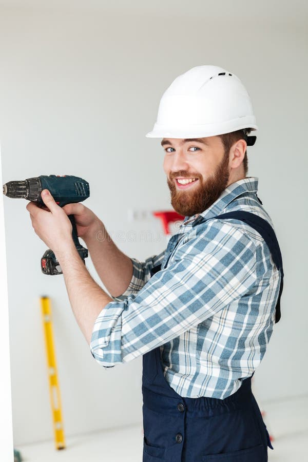 Young Man Using Drill To Make Repair Stock Image - Image of indoors ...