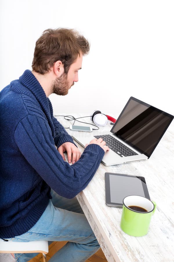 Young Man Using His Laptop Computer at Home Stock Image - Image of ... Young Man Using His Laptop Computer at Home Stock Image - Image of ...