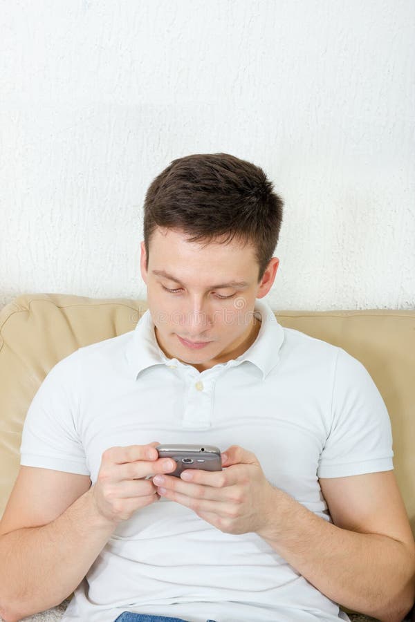 Young Man Using His Mobile Phone Stock Image - Image of cellphone, cell ...