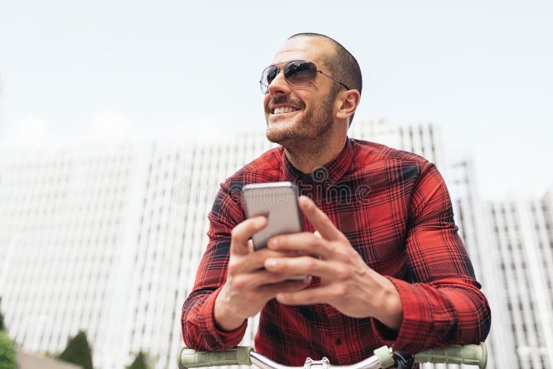 Young Man Using His Mobile in the Street. Stock Image - Image of beard ...