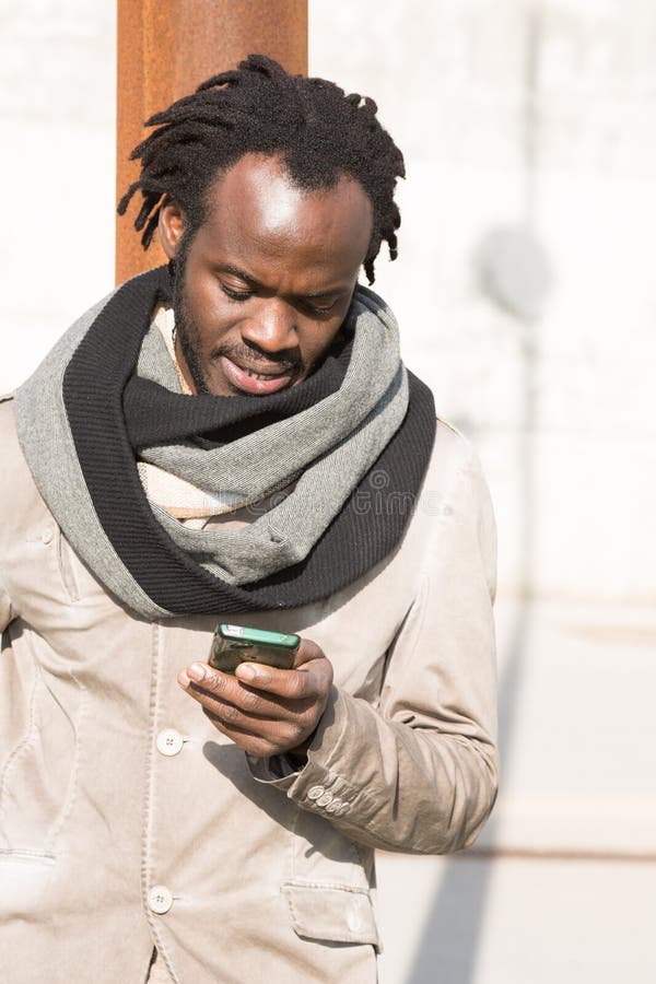 Young man using his phone stock photo. Image of male - 38155144