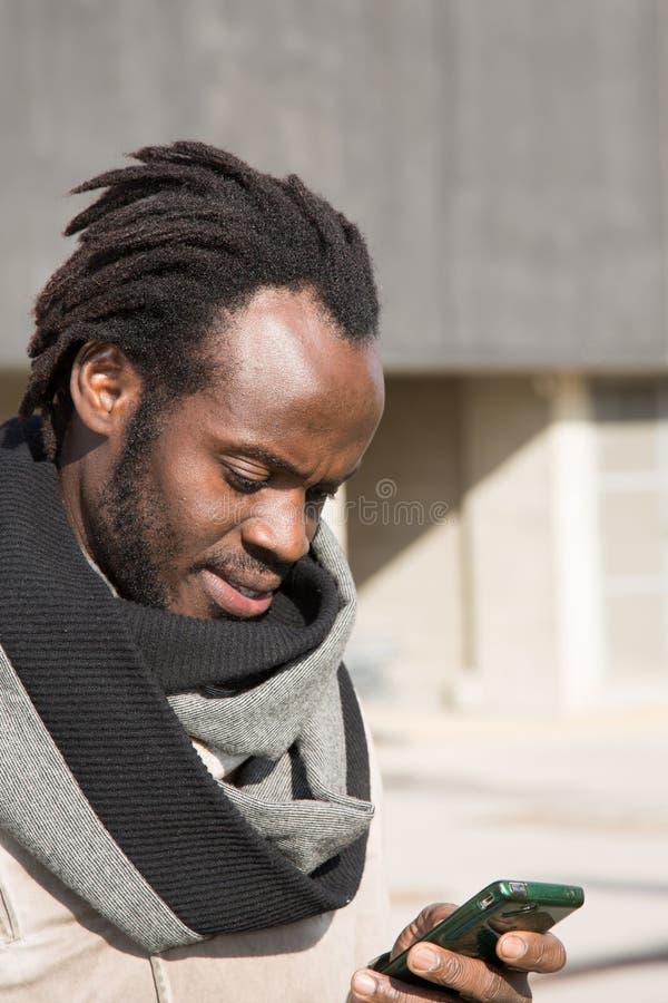 Young man using his phone stock photo. Image of model - 38155264