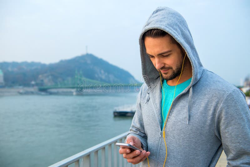 Young man using his phone stock photo. Image of mobile - 123654950