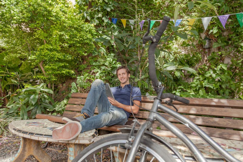 Young man using the ipad stock image. Image of adult - 64047693