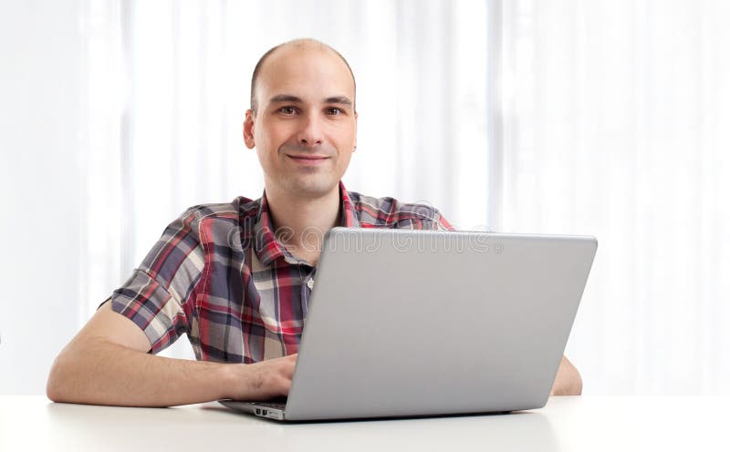 Young man using a laptop stock image. Image of casual - 28101747