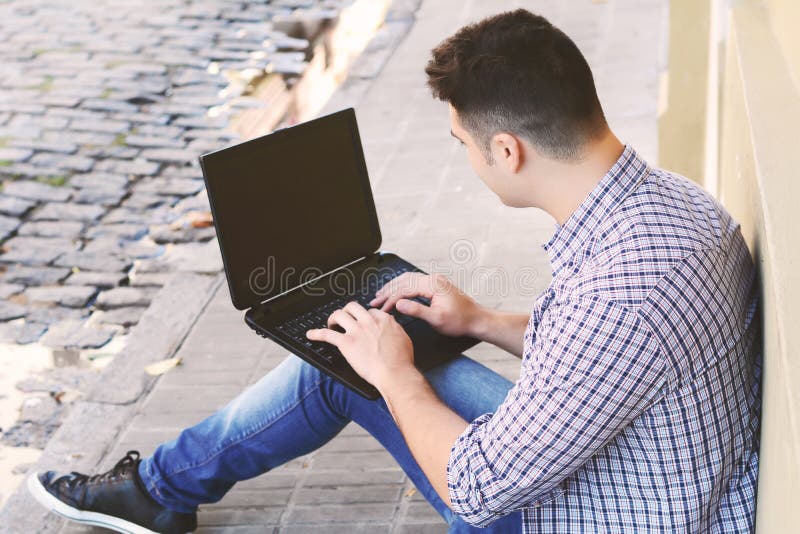 Young man using laptop stock image. Image of communicating - 85059773