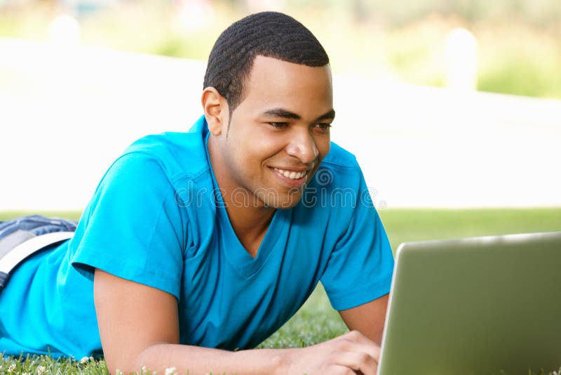 Attractive Young Man Pointing To Laptop Screen Stock Photo - Image of ...