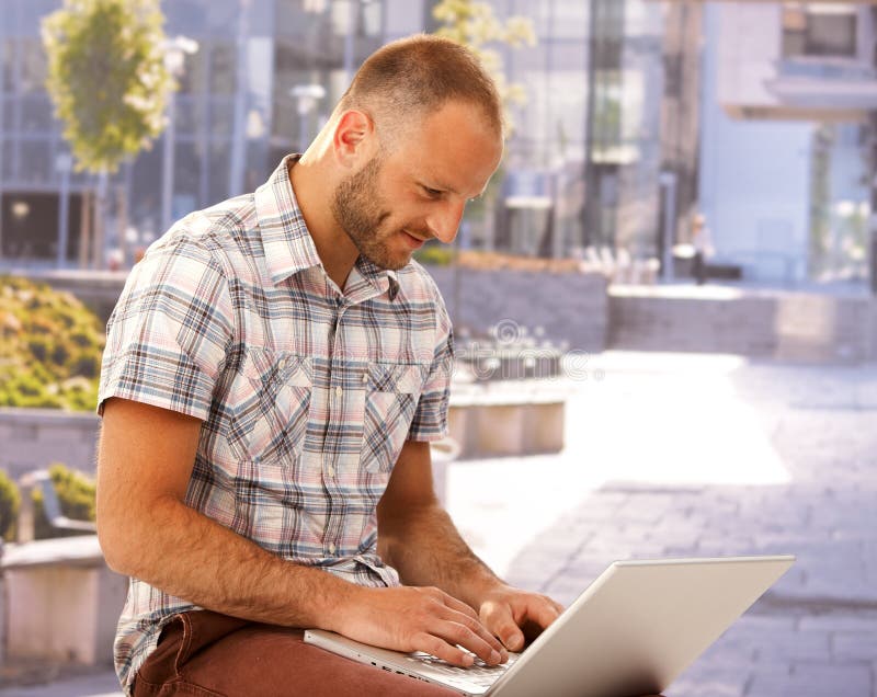 Young Man Using Laptop Outdoors Stock Photo - Image of people, online ...