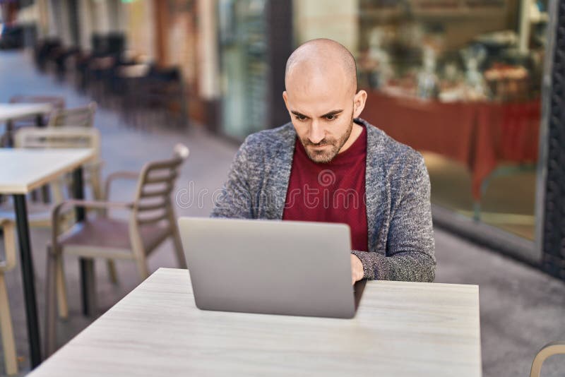 Young Man Using Laptop Sitting on Table at Coffee Shop Terrace Stock ...
