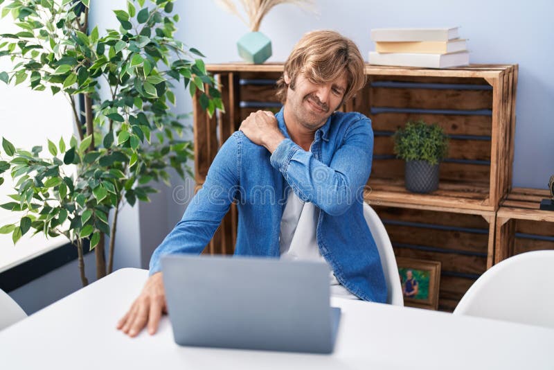 Young Man Using Laptop Suffering for Back Ache at Home Stock Photo ...