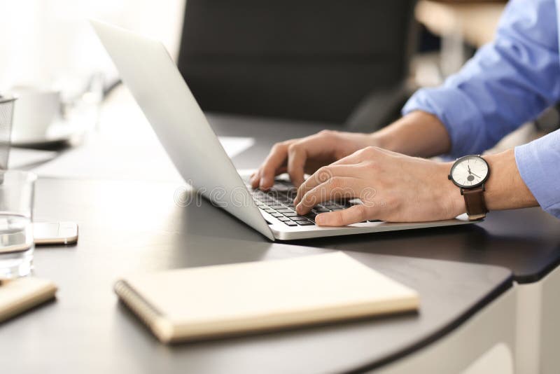 Young Man Using Laptop To Get Ready for Business Meeting in Office ...