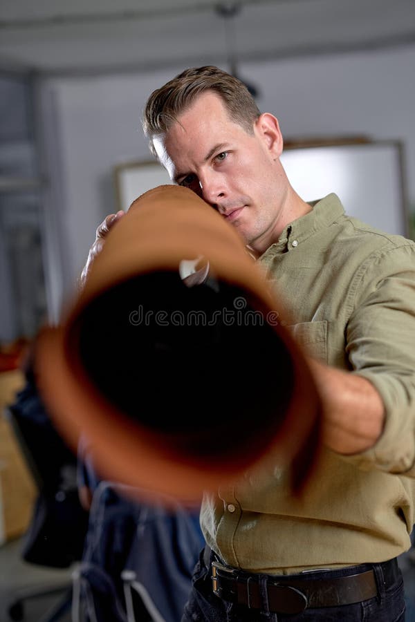 Young Man Using Leather Roll As a Grenade Launcher. Stock Image - Image ...