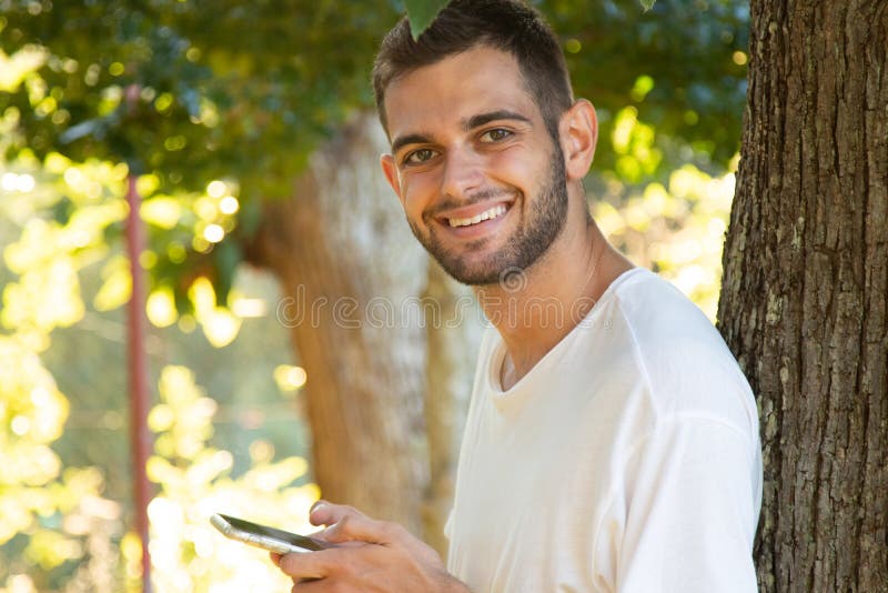 Man Using Mobile Phone Outdoors Stock Photo - Image of smiling ...