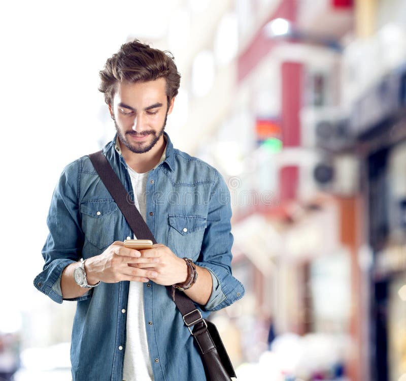 Young Man Using Mobile Phone in Street Stock Image - Image of internet ...