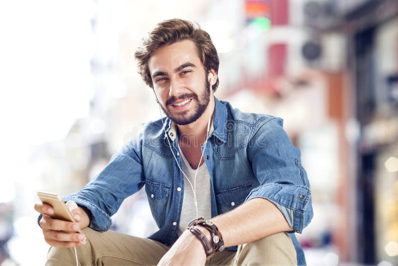 Young Man Using Mobile Phone in Street Stock Photo - Image of street ...