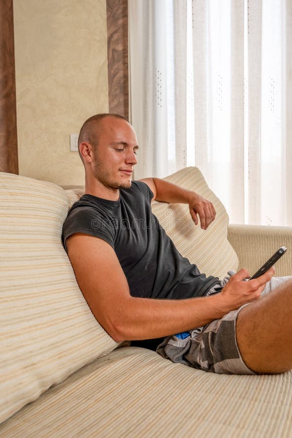 Young Man Using Mobile Phone To Send Short Message. Technology Concept ...