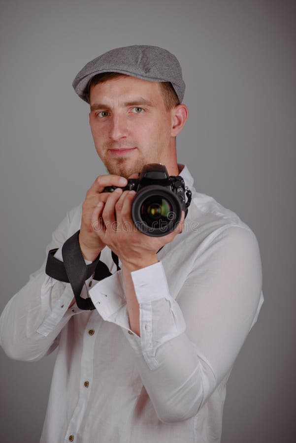 Young Man Using a Professional Camera Stock Photo - Image of reporter ...