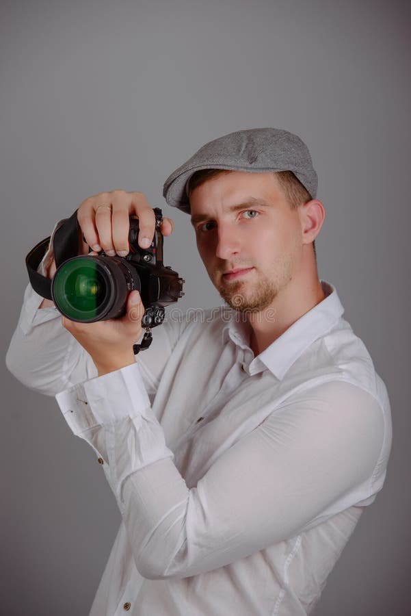 Young Man Using a Professional Camera Stock Photo - Image of cameraman ...