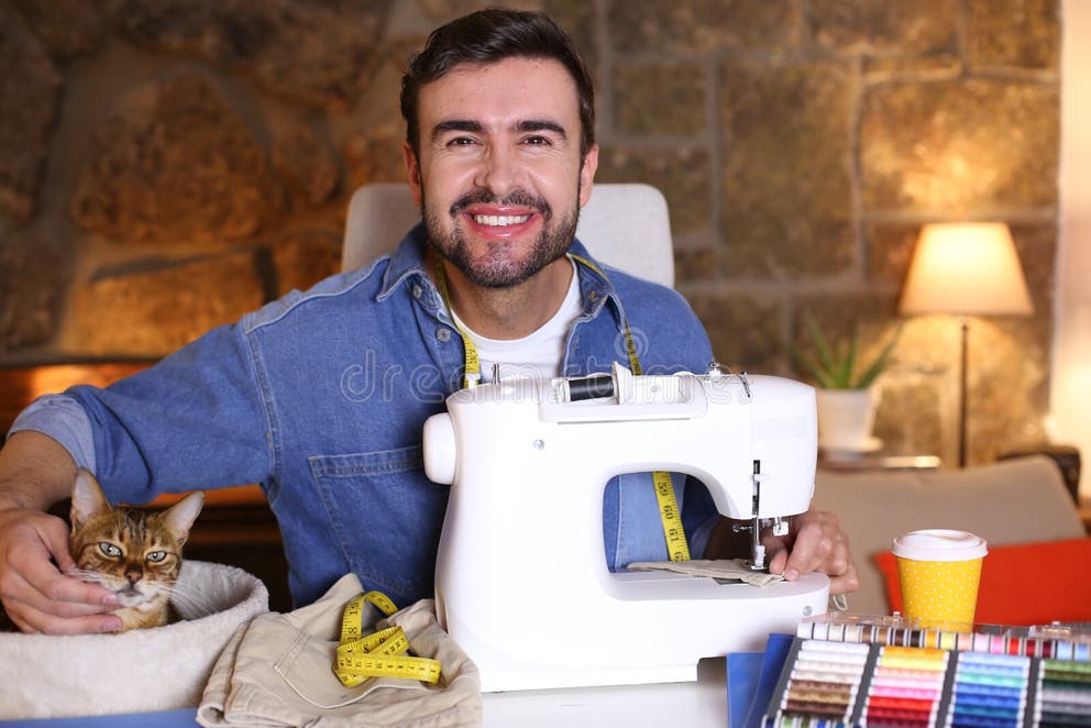 Young Man Using Sewing Machine Stock Photo - Image of couture, cloth ...