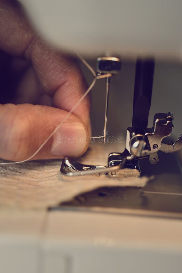 Young Man Using a Sewing Machine Stock Photo - Image of chores ...