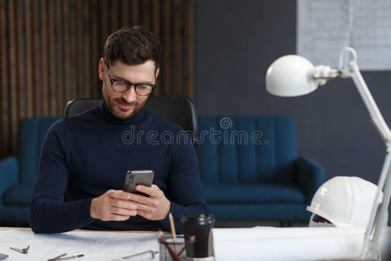 Young Man Using Smartphone and Smiling. Happy Businessman Using Mobile ...