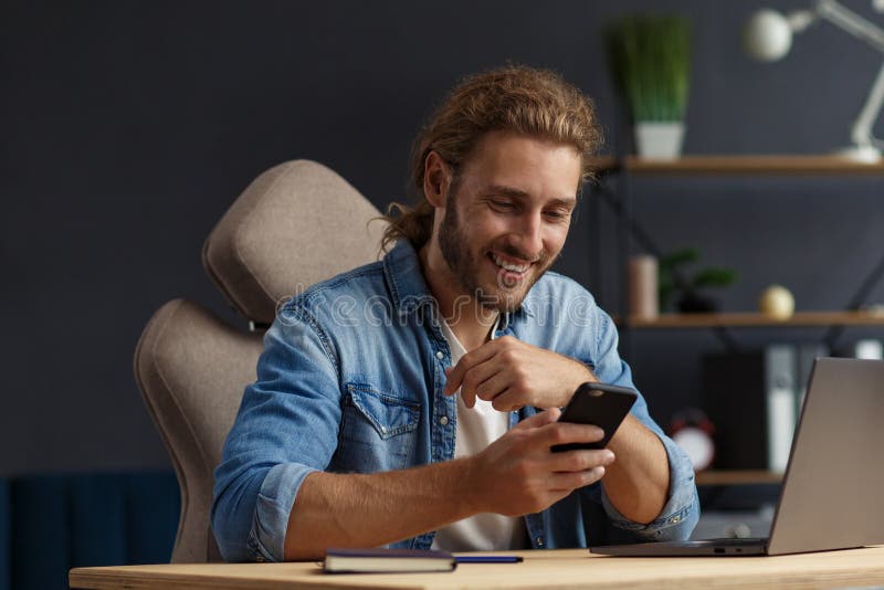 Young Man Using Smartphone and Smiling. Happy Businessman Using Mobile ...