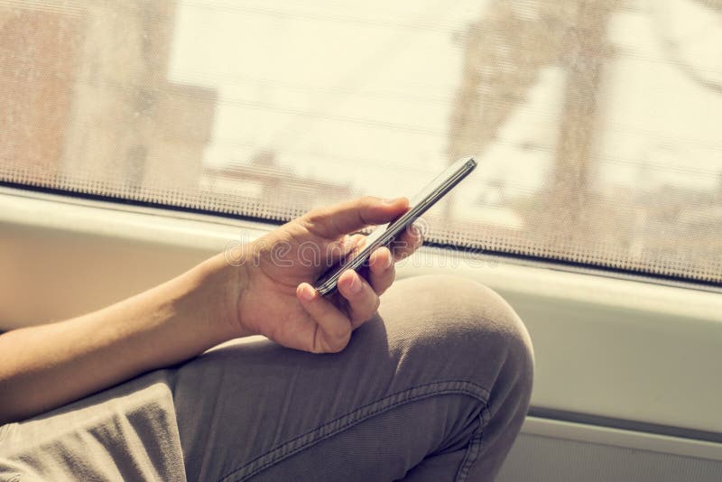 Young Man Using a Smartphone in a Train or a Subway Stock Photo - Image ...