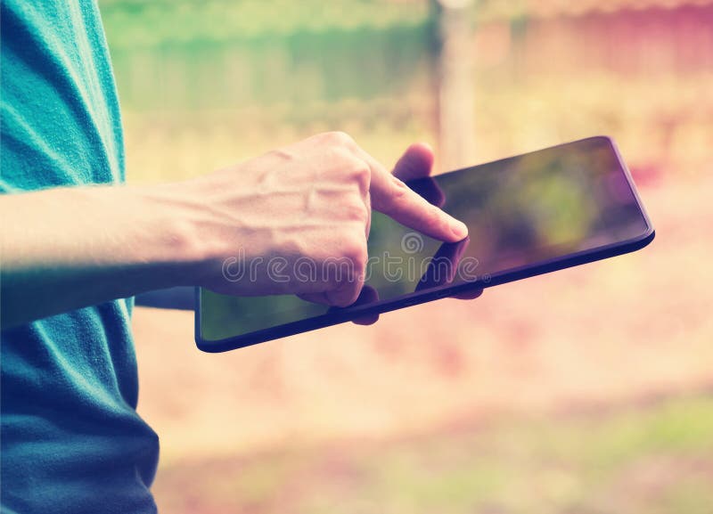 Young Man Using Tablet Device Outside Stock Image - Image of person ...