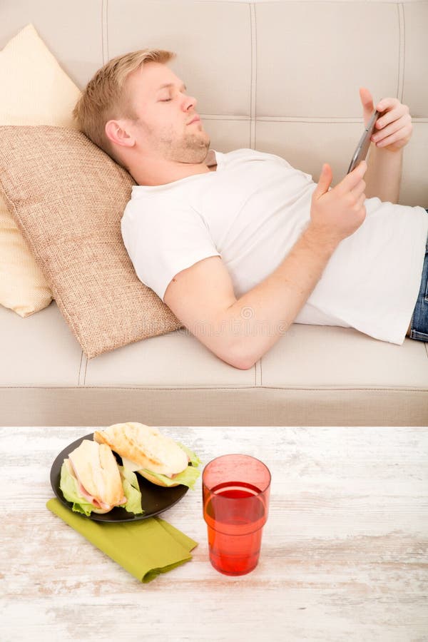 Young Man Using a Tablet at Home Stock Image - Image of relaxing, home ...