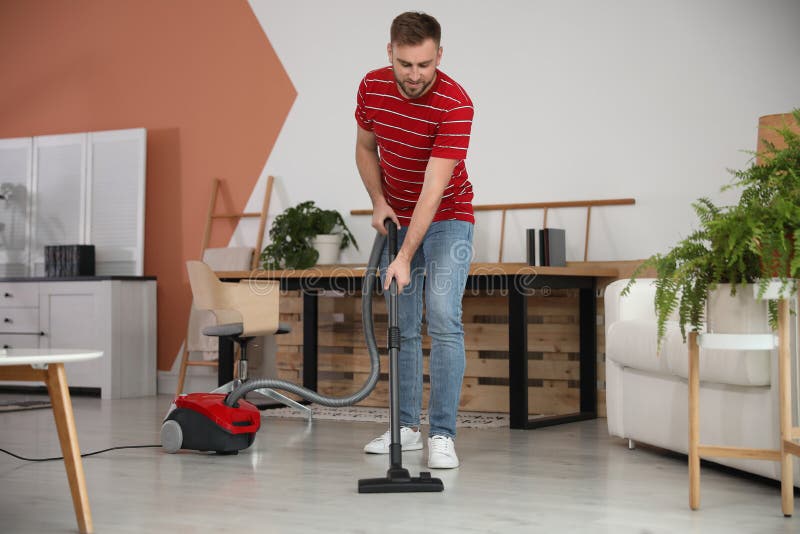 Young Man Using Vacuum Cleaner at Home Stock Photo - Image of cleaner ...