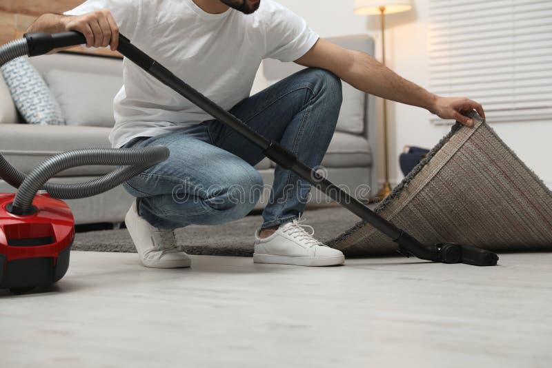 Young Man Using Vacuum Cleaner at Home Stock Image - Image of apartment ...