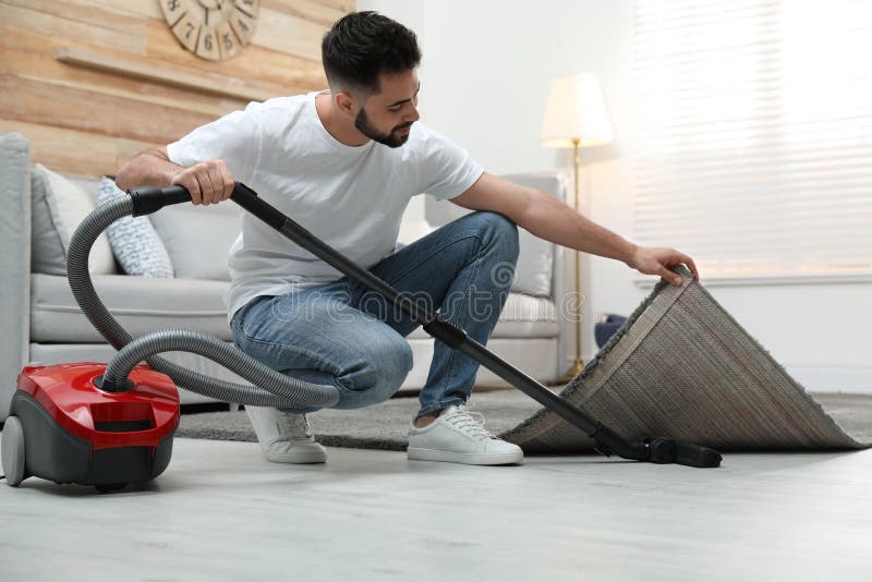 Young Man Using Vacuum Cleaner Stock Image - Image of hoover, appliance ...